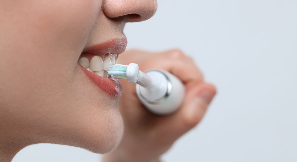 Experience the Buzz: The Advantages of Electric Toothbrushes Over ...